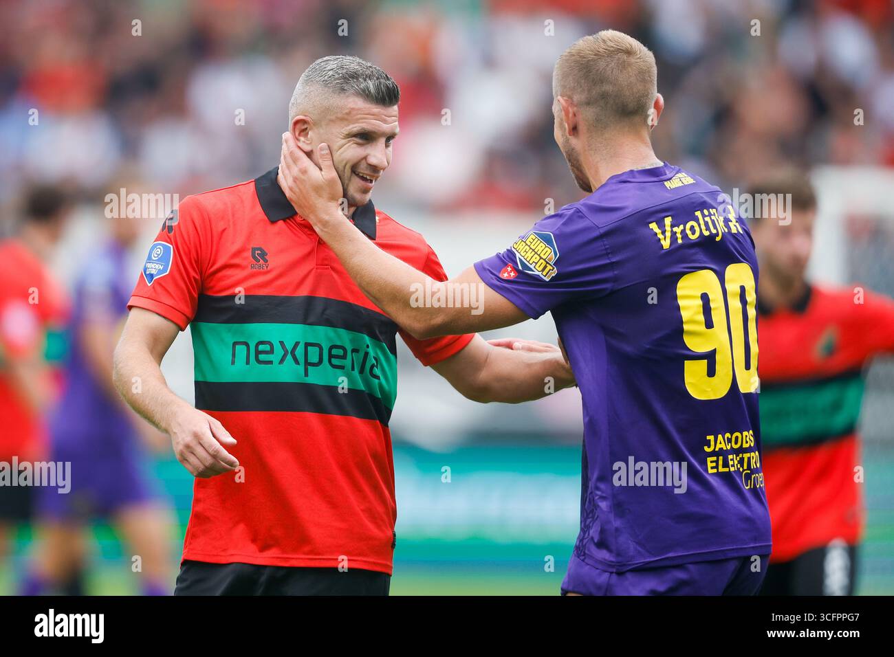 NIJMEGEN, NETHERLANDS - AUGUST 24: Bryan Linssen of NEC, Lewis Holtby ...