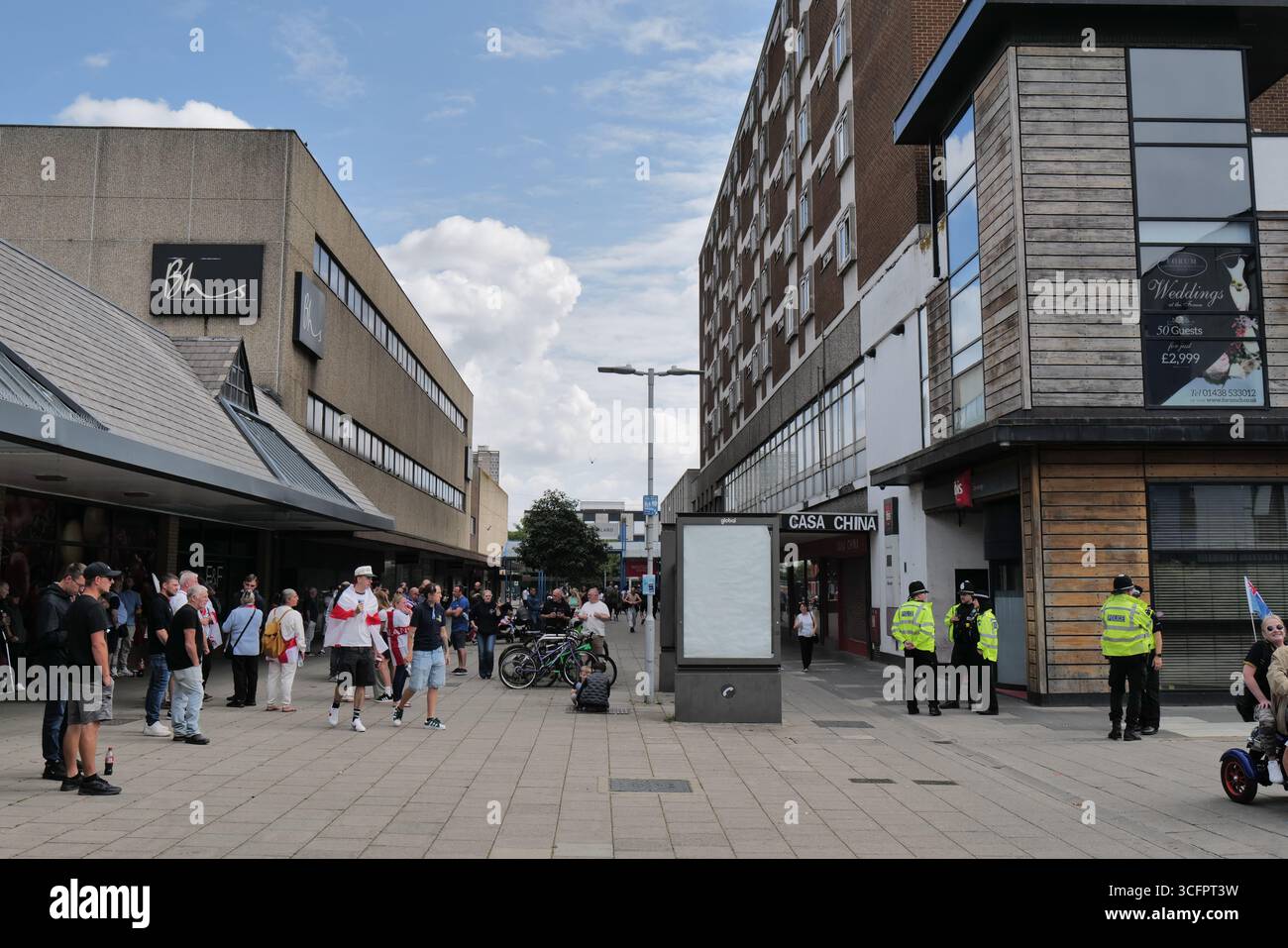Stevenage, UK 24 August 2025. View of the street were a small crowd ...