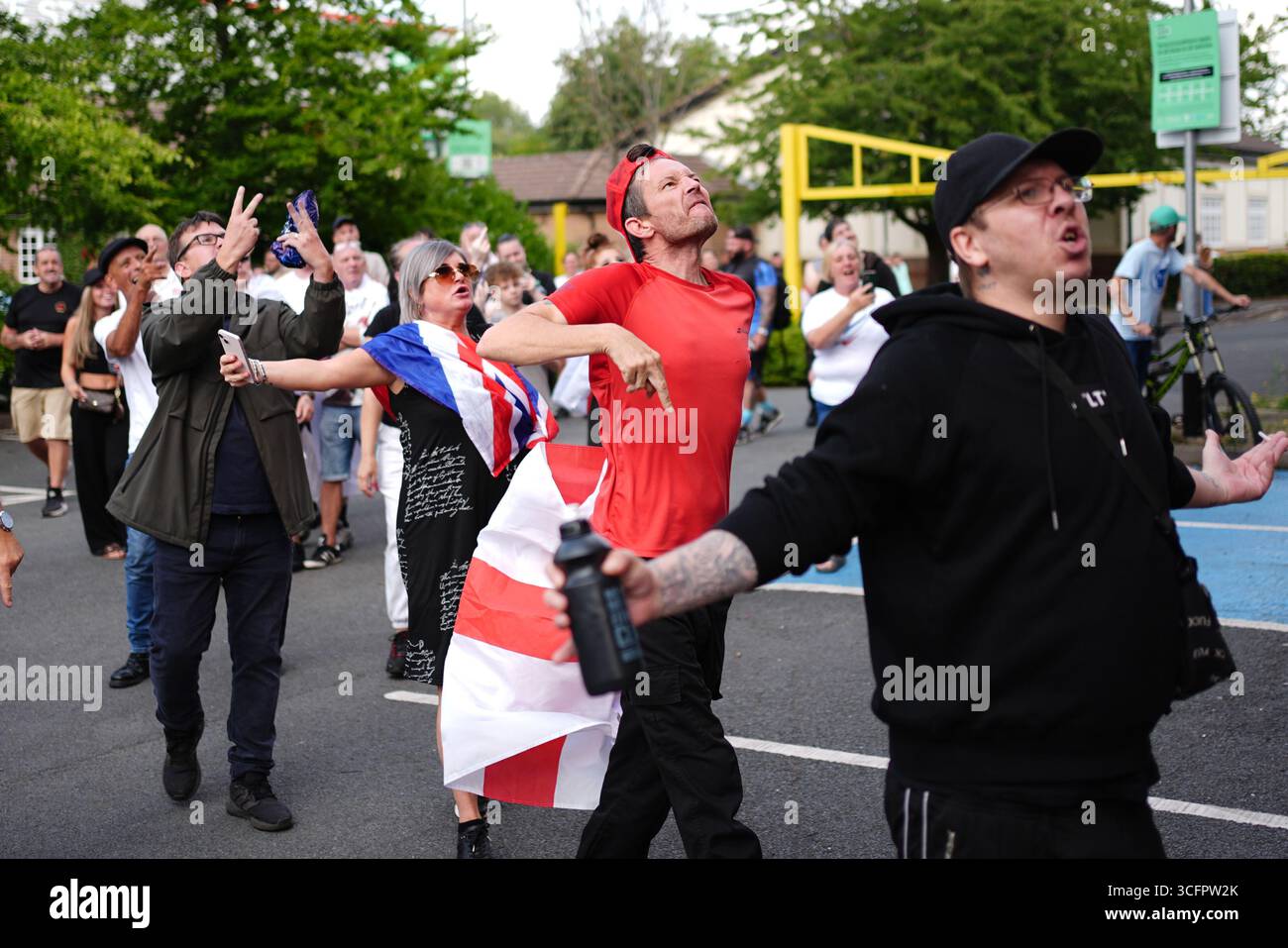 EDS NOTE HAND GESTURES People demonstrating under the Abolish Asylum ...