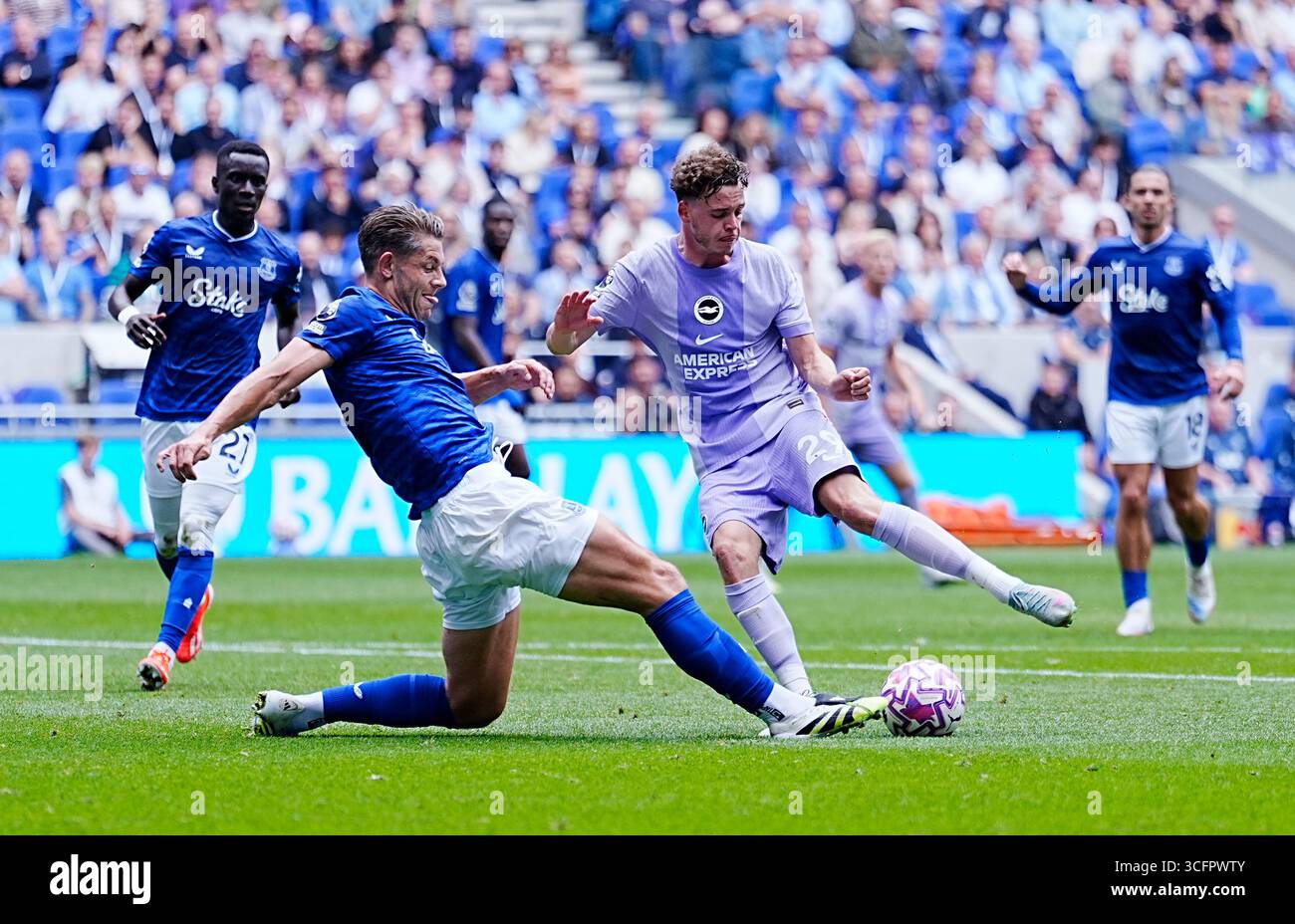 Everton's James Tarkowski (left) and Brighton and Hove Albion's Maxim ...