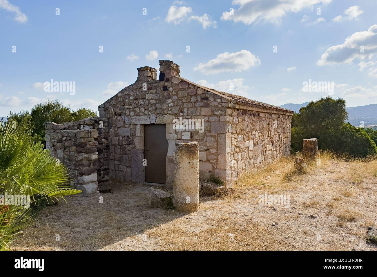 Old small Christian chapel built of stone blocks with tiled roof ...