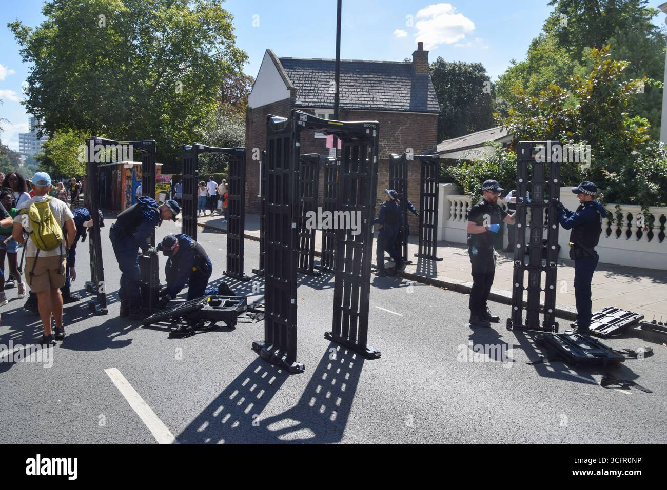 London, UK. 24th August 2025. Police officers install knife arches on ...