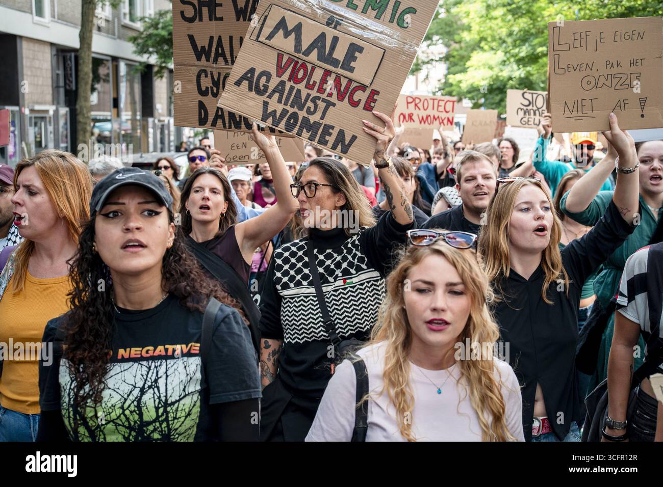 ROTTERDAM - Participants in a protest march against femicide. With the ...