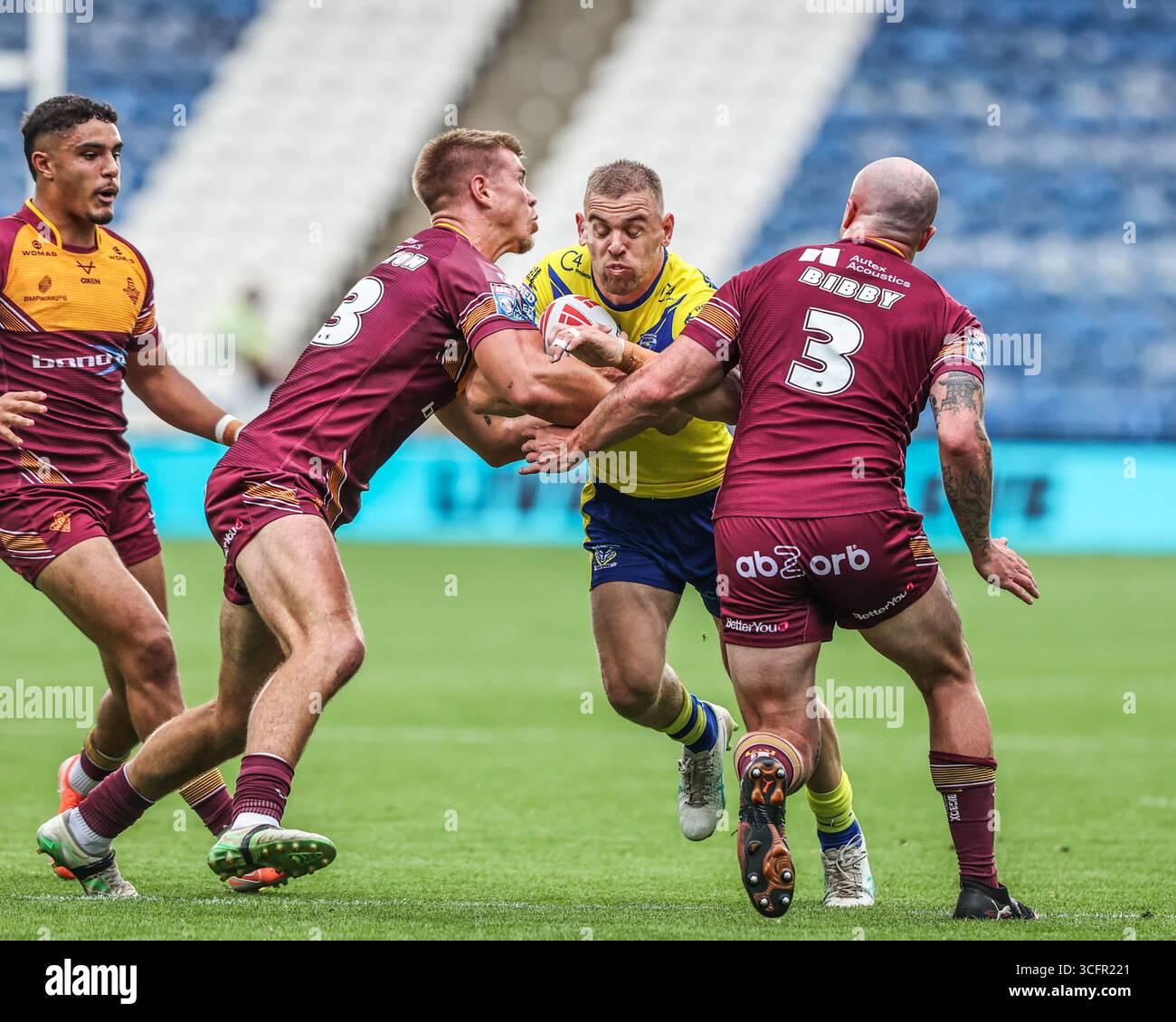Matt Dufty of Warrington Wolves is tackled during the Betfred Super ...