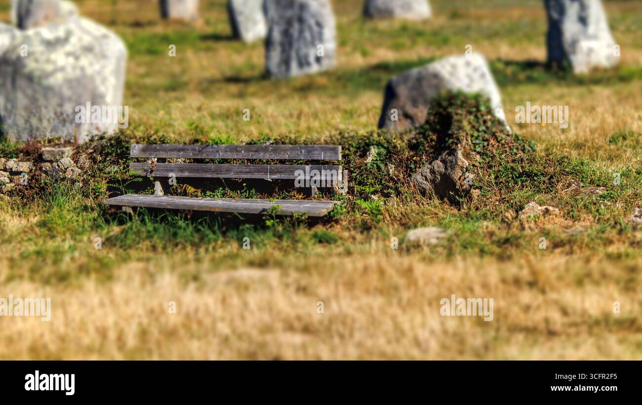 Bench placed between two menhirs in Carnac, Brittany, France ...