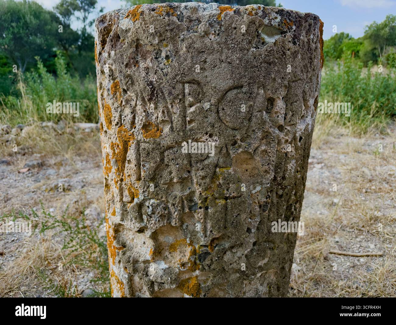 Archaeological Roman milestone marker carved with Latin letters ...
