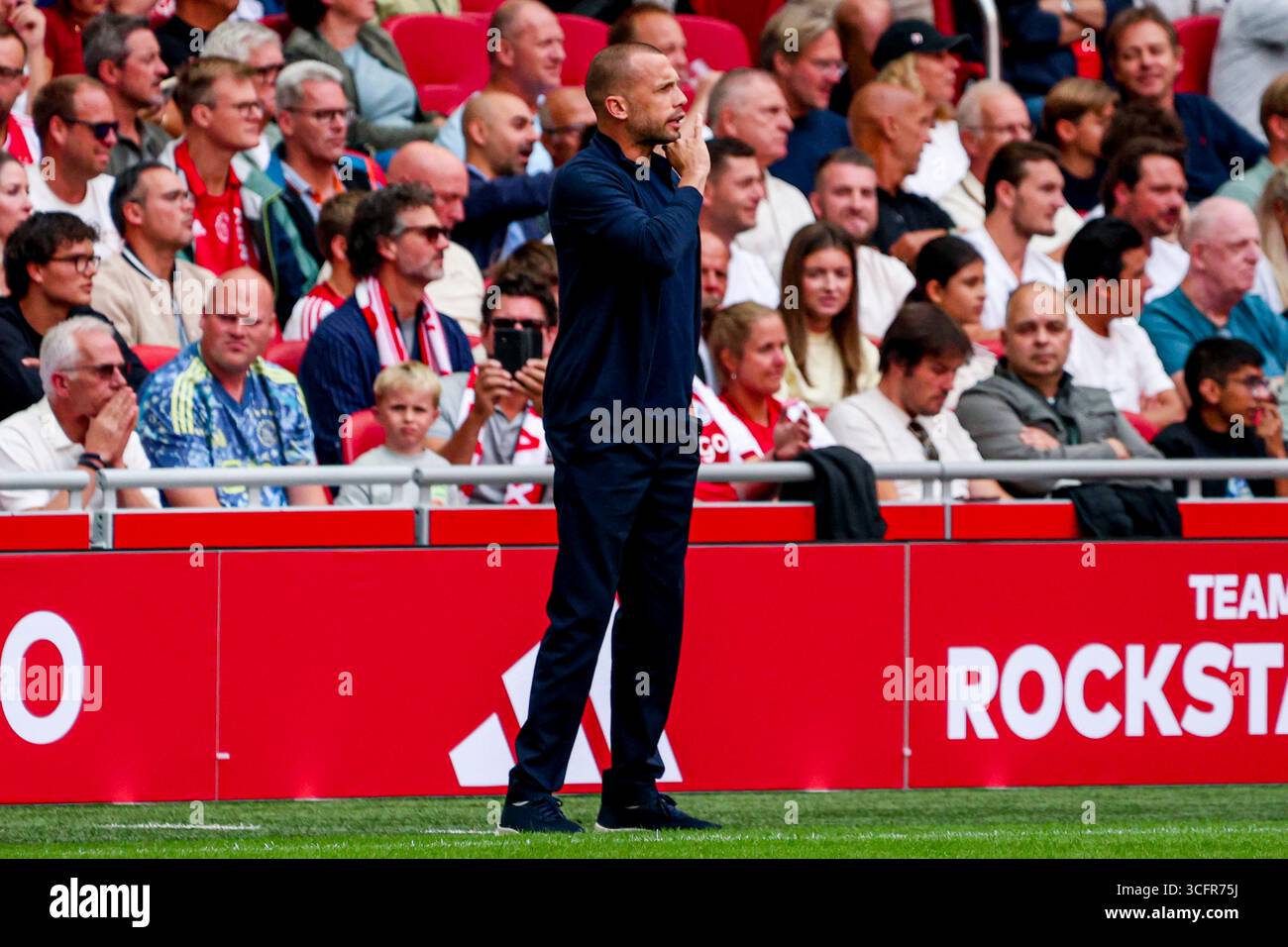 head coach John Heitinga of AFC Ajax looks on during the Dutch ...