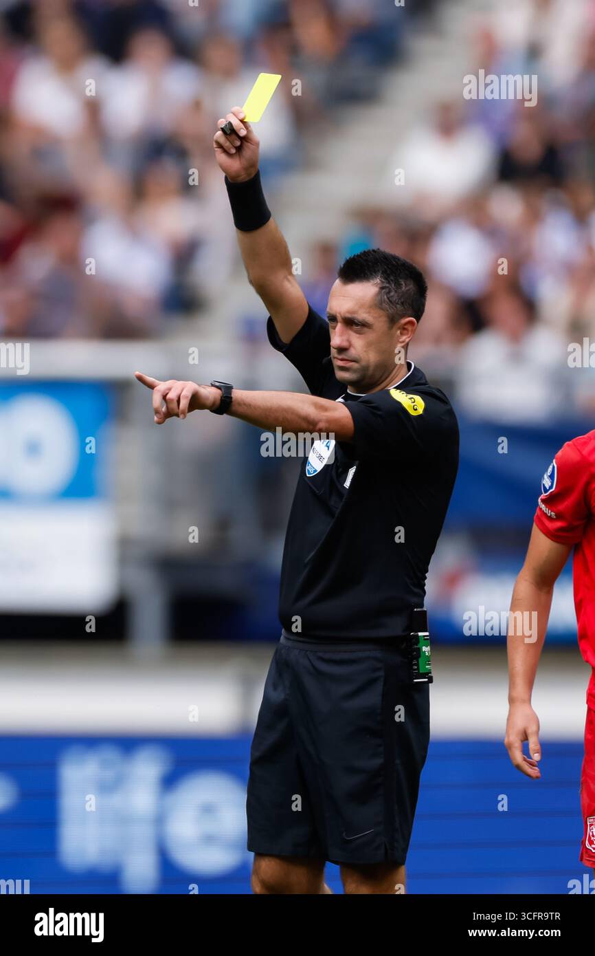 referee Dennis Higler shows the yellow card during the Dutch Eredivisie ...