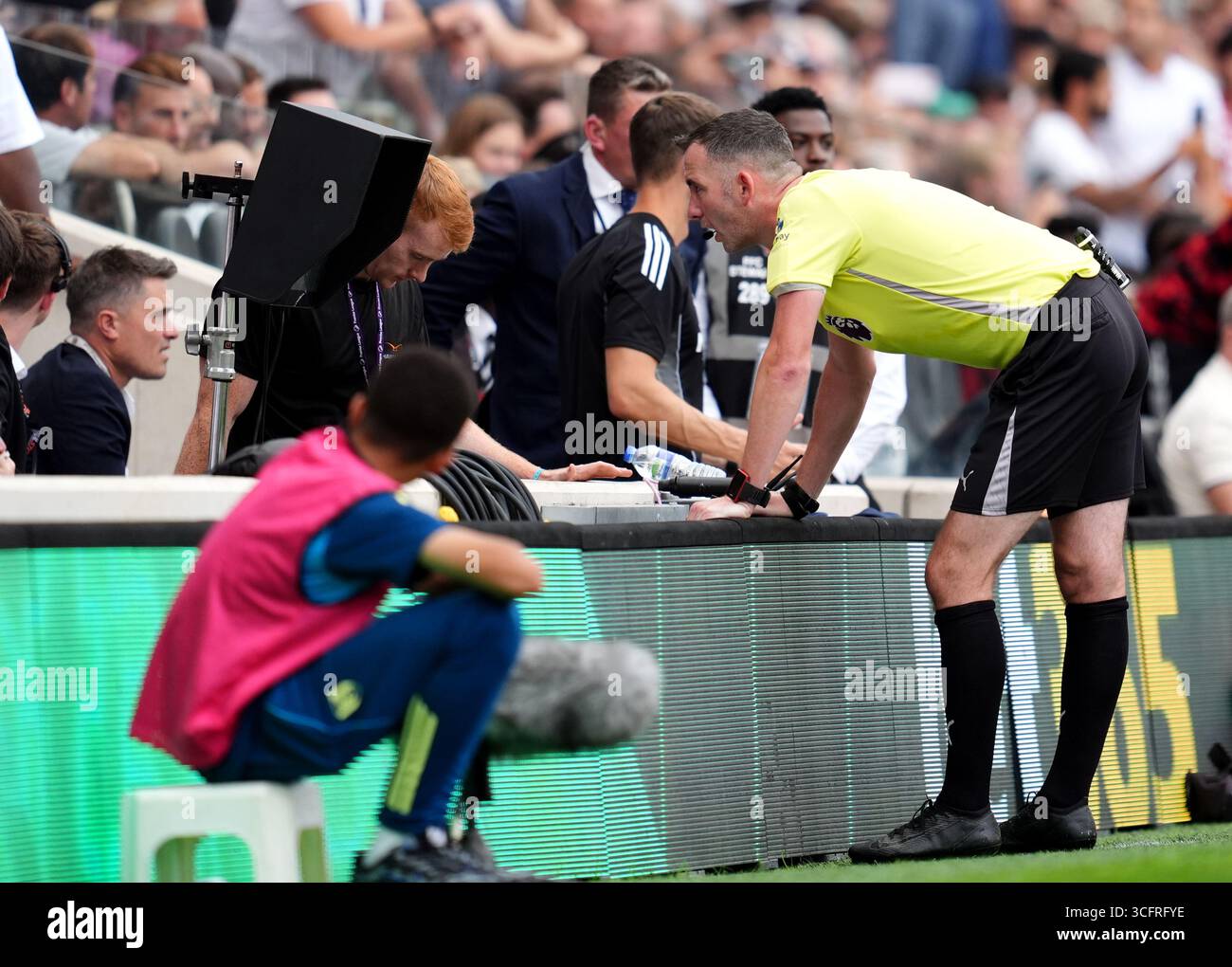 Referee Chris Kavanagh checks VAR for a penalty during the Premier ...