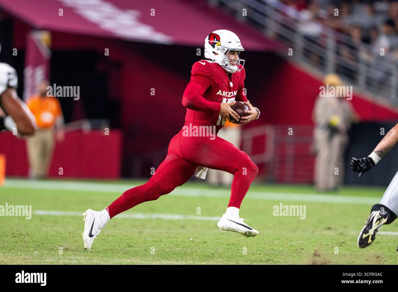 Arizona Cardinals quarterback Clayton Tune (15) runs with the ball in a ...