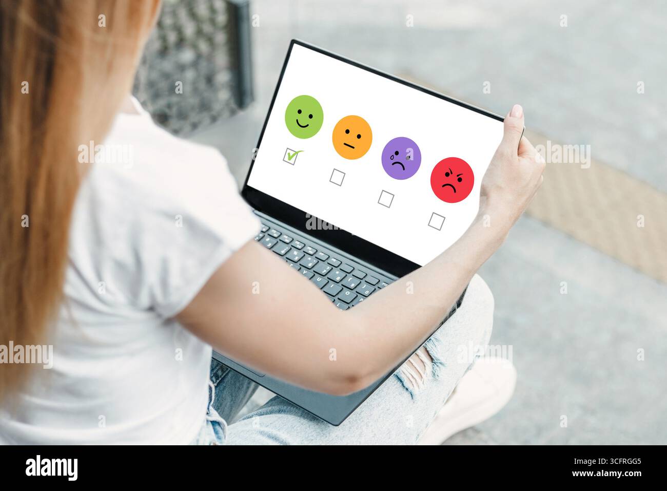 mental health concept. icons with emoticons in the laptop. the girl ...