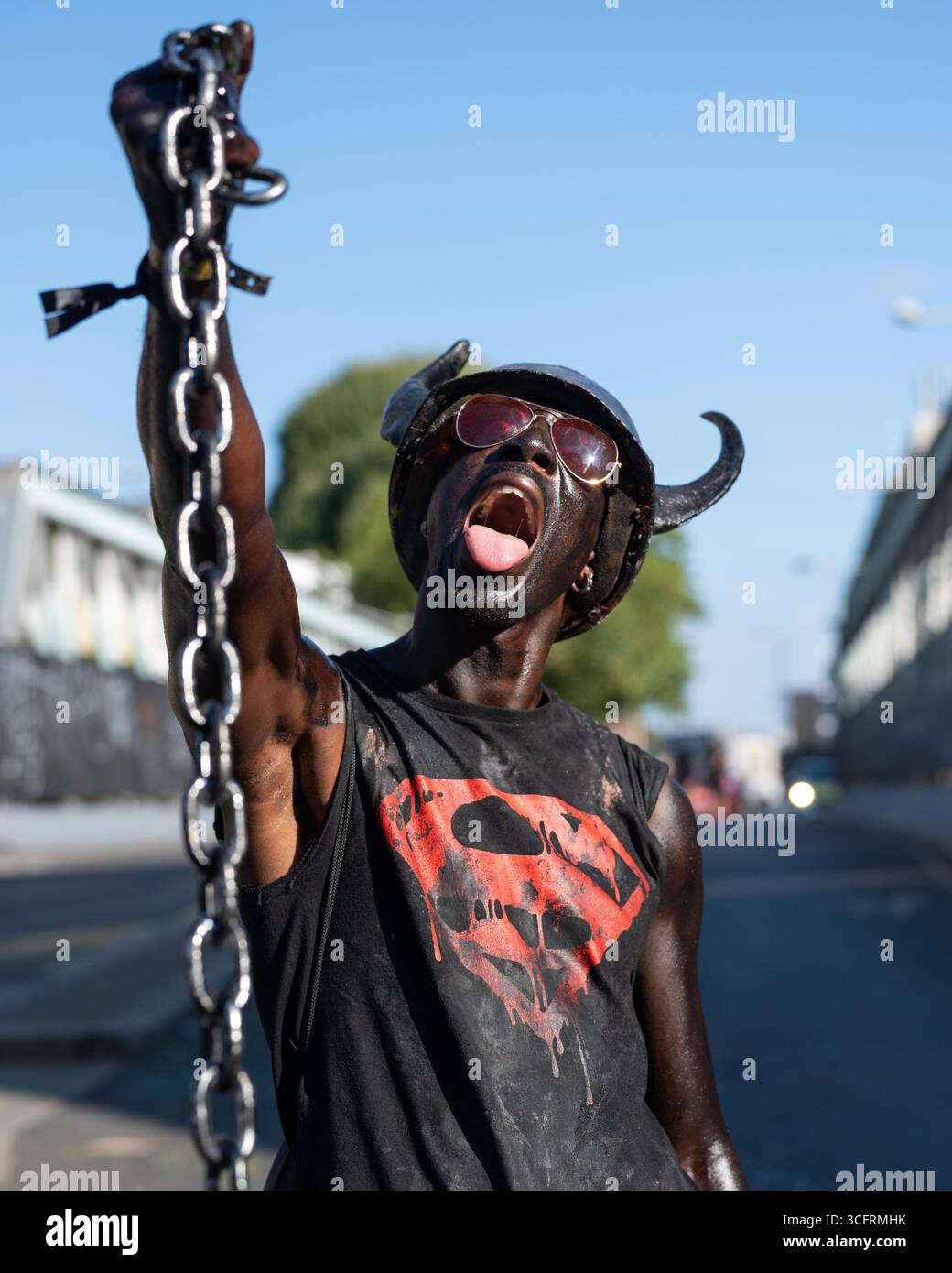 London, UK. 24 August 2025. Participants clad in black paint, horns ...