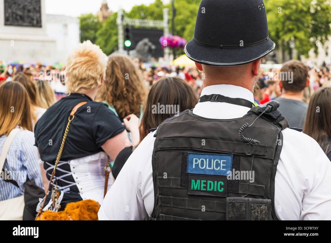 UK Police Medic Overseeing Crowd Safety at City Parade, Uniformed ...