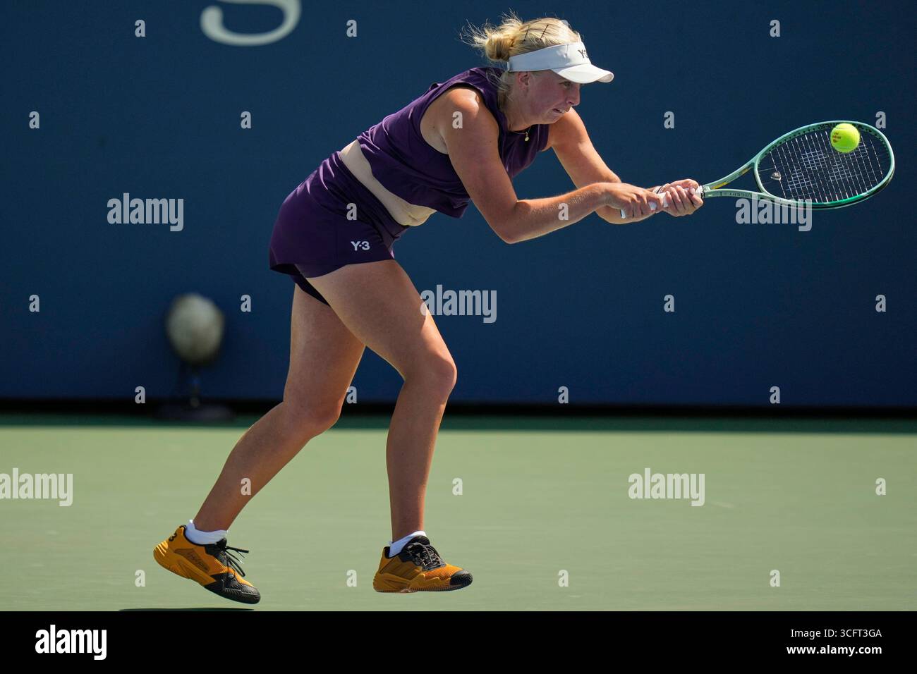 Clara Tauson, of Denmark returns a shot to Alexandra Ella, of the ...