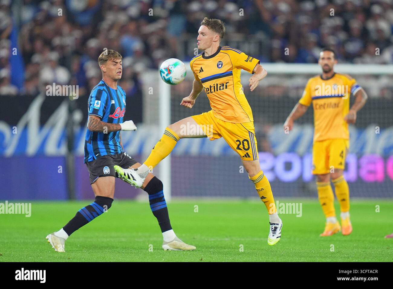 Atalanta's Daniel Maldini fights for the ball with Pisa's Michel ...