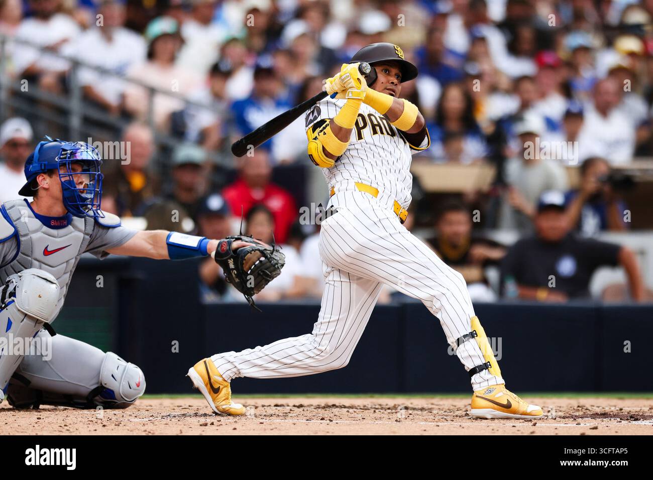 San Diego Padres' Luis Arraez follows through on a swing during an at ...