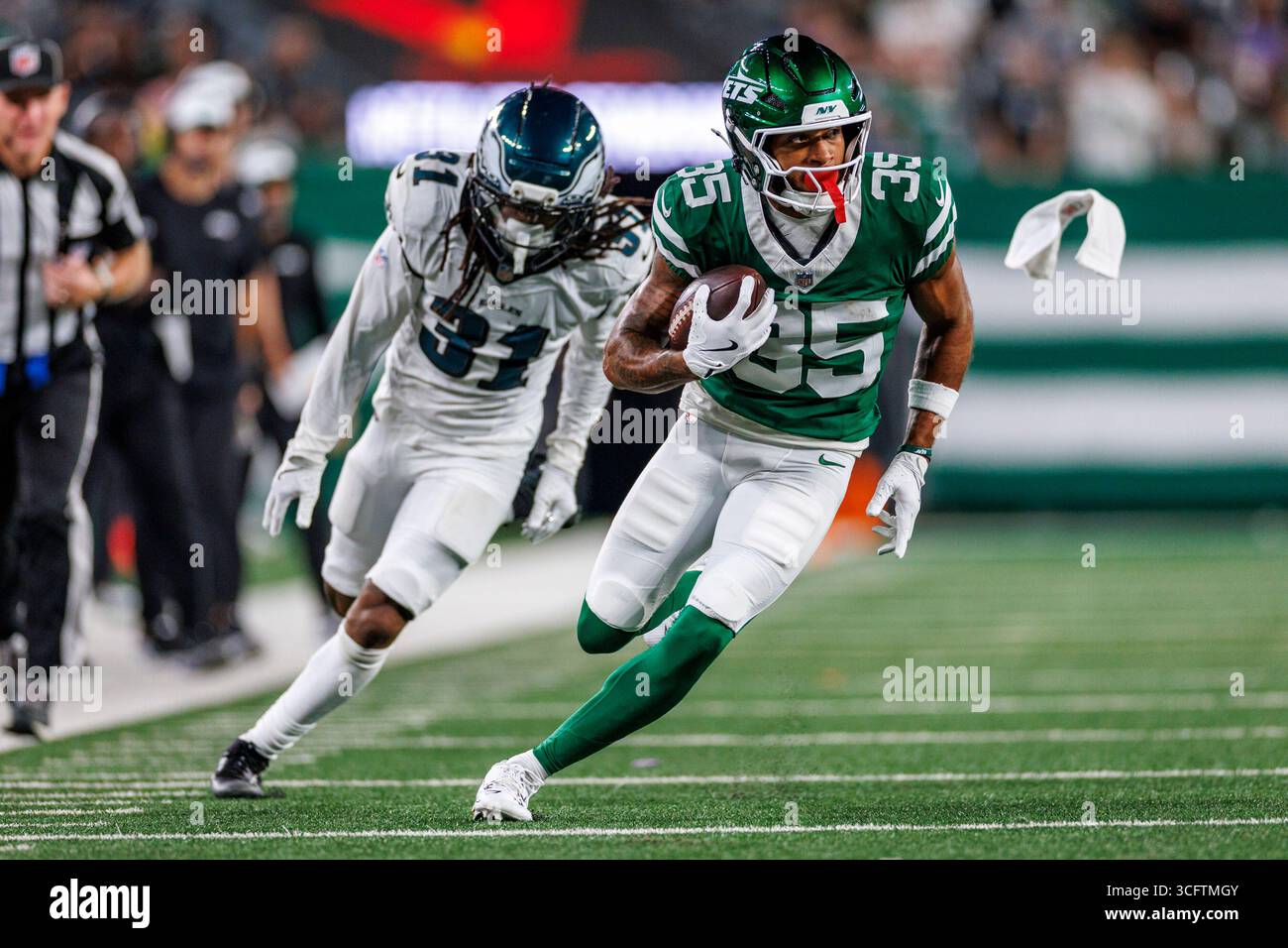 New York Jets wide receiver Dymere Miller (35) runs the ball past ...