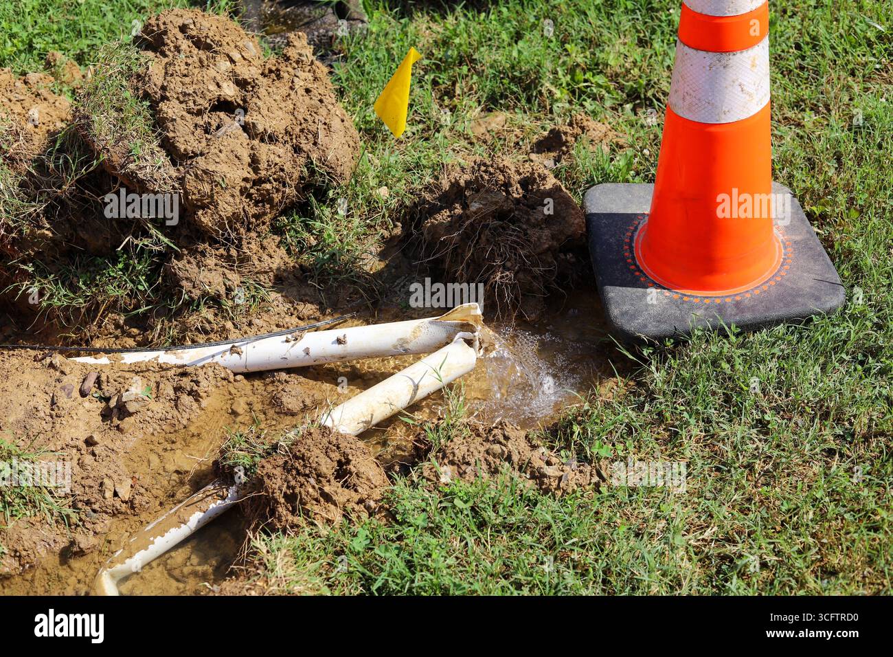 A broken sump pump PCV pile in the ground Stock Photo - Alamy