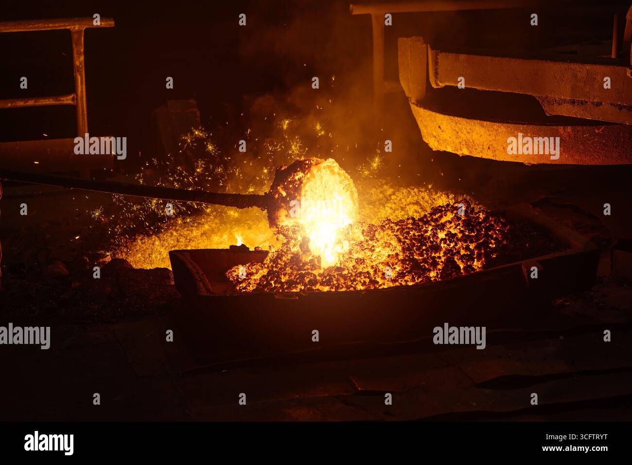 Removing slag from surface of hot iron in melting furnace Stock Photo ...