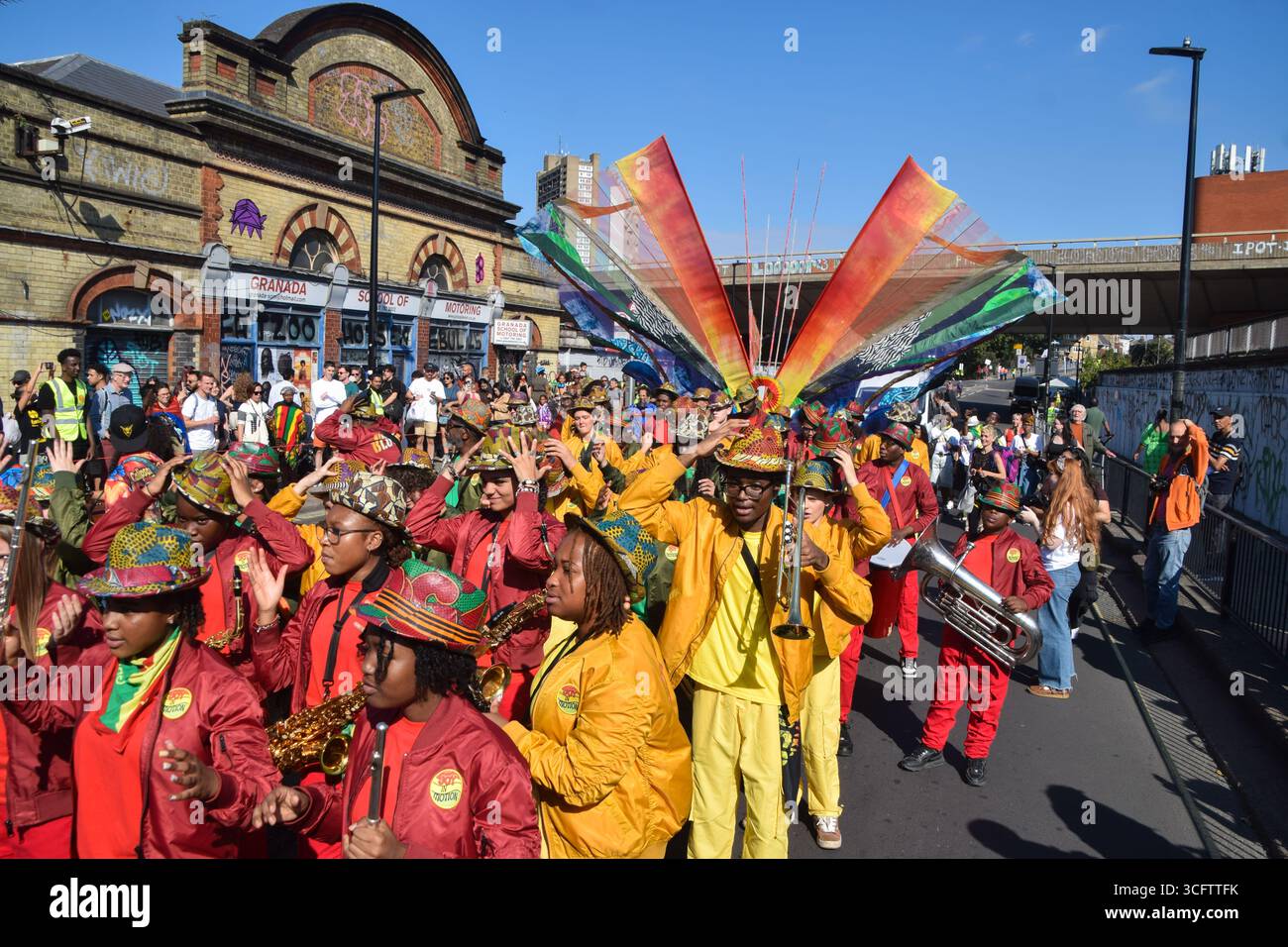 London, UK. 24th August 2025. Performers take part in the parade on the ...