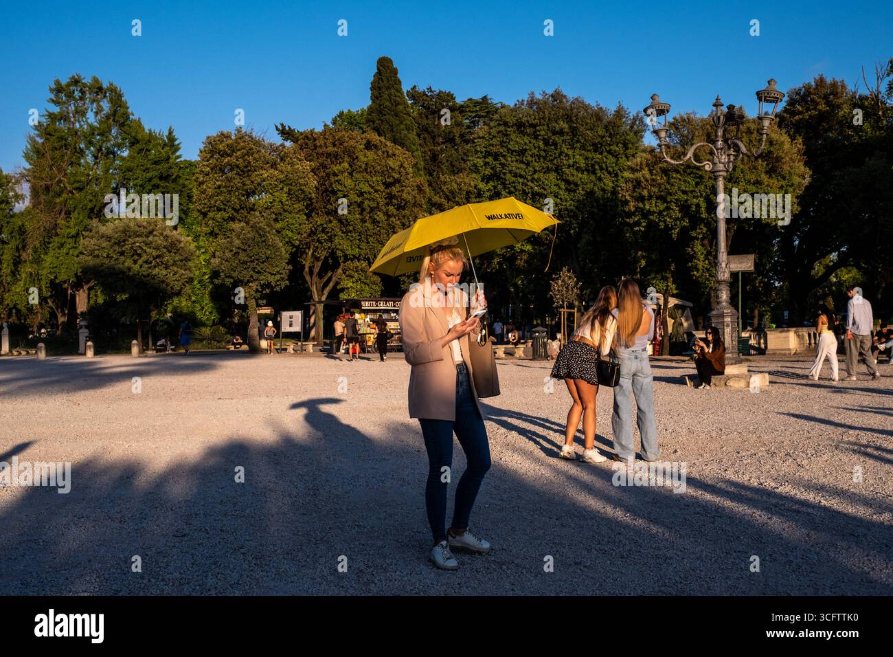 Daily Life in Rome A woman holding an umbrella on May 12, 2025 in Rome ...