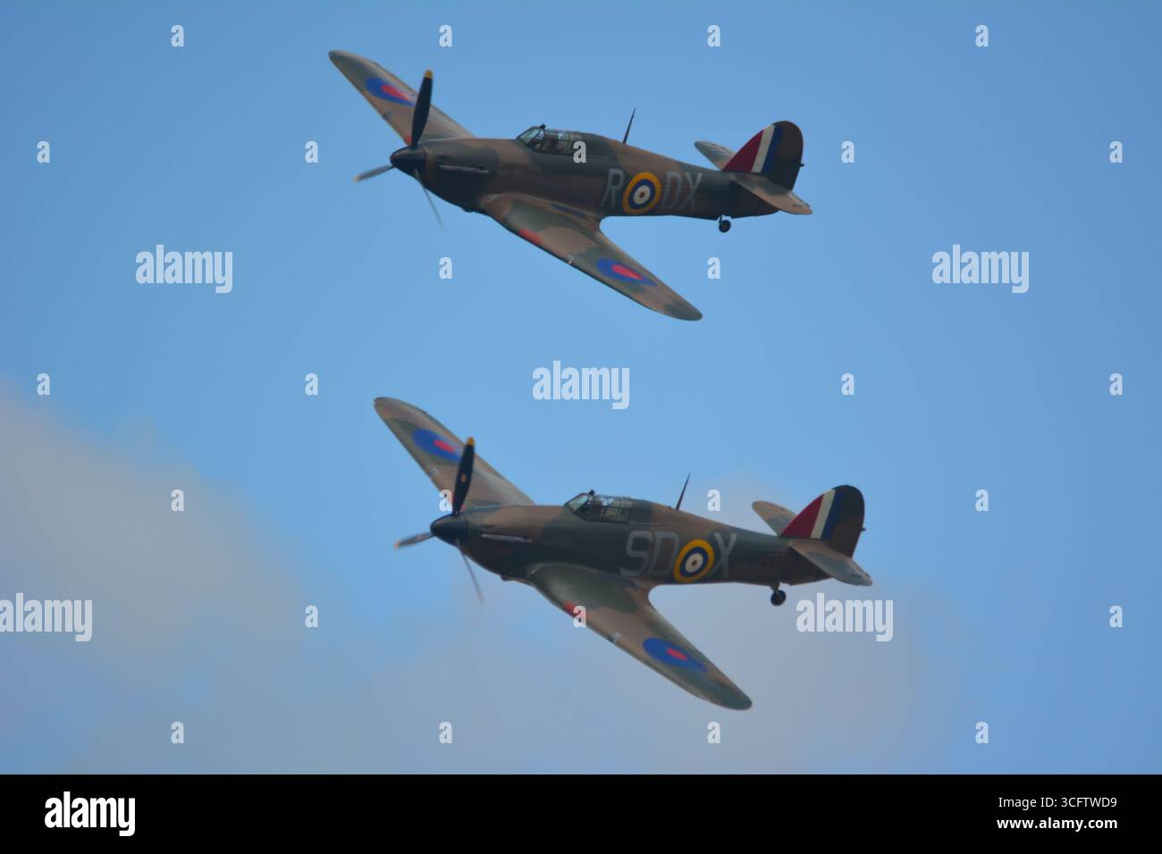Two WW2 Hawker Hurricane fighters in formation over Sywell Aerodrome ...