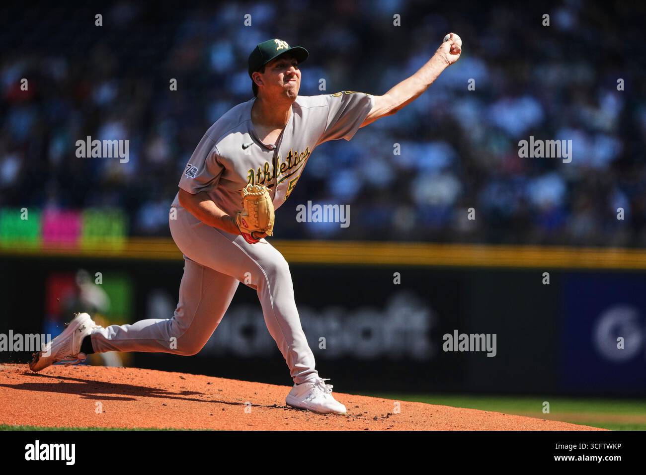 Athletics starting pitcher Jacob Lopez throws against the Seattle ...