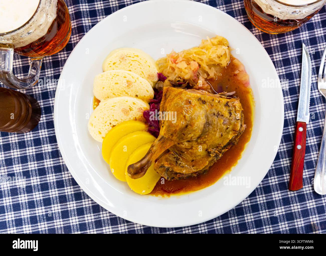 Roasted duck quarter with cabbage Stock Photo - Alamy