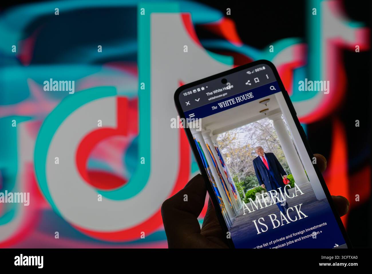 The White House front page is displayed on a mobile phone with TikTok ...