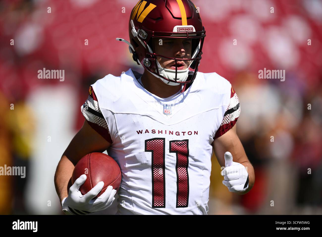 Washington Commanders wide receiver Luke McCaffrey (11) warms up before ...