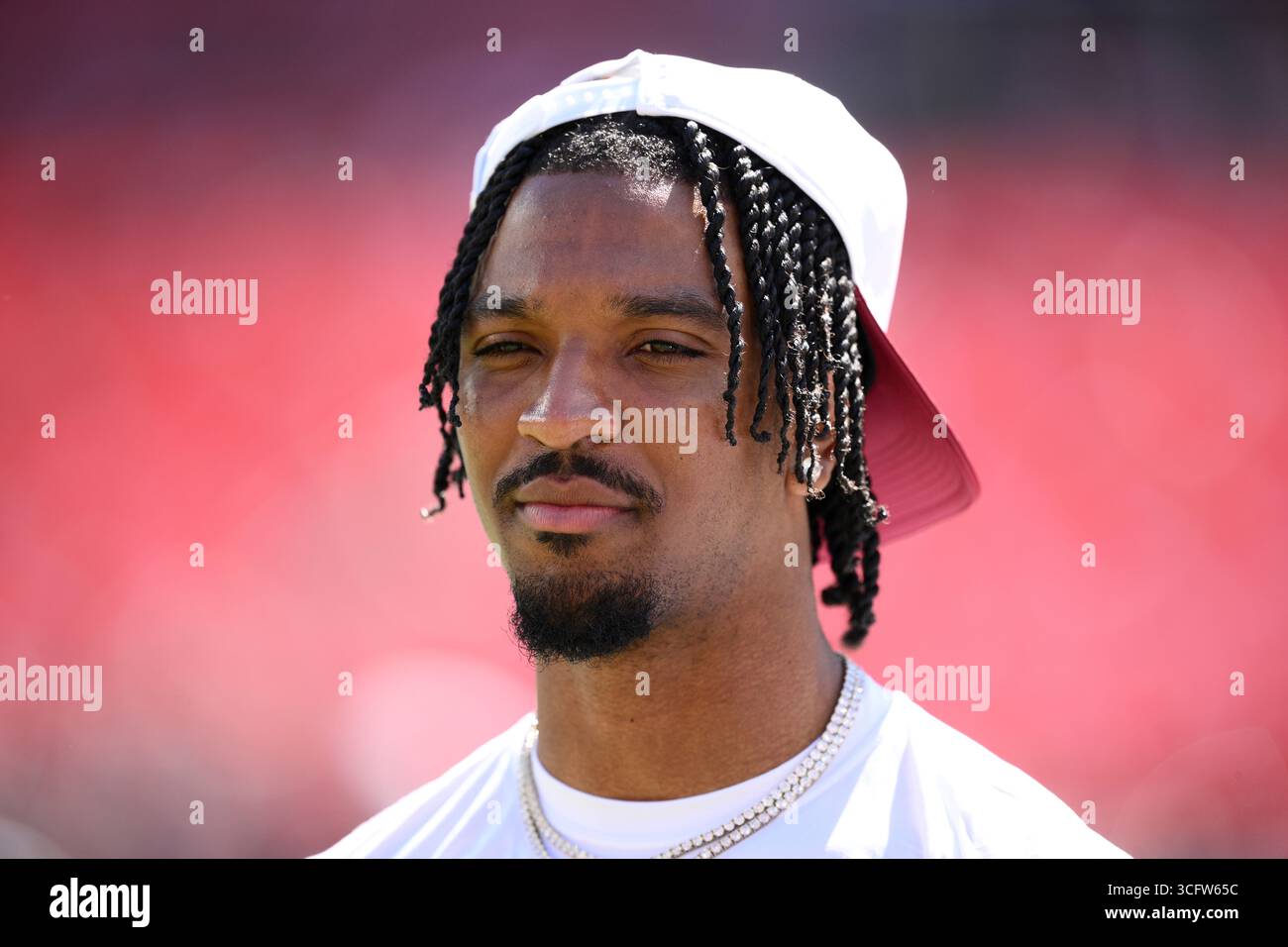 Washington Commanders quarterback Jayden Daniels looks on before an NFL ...