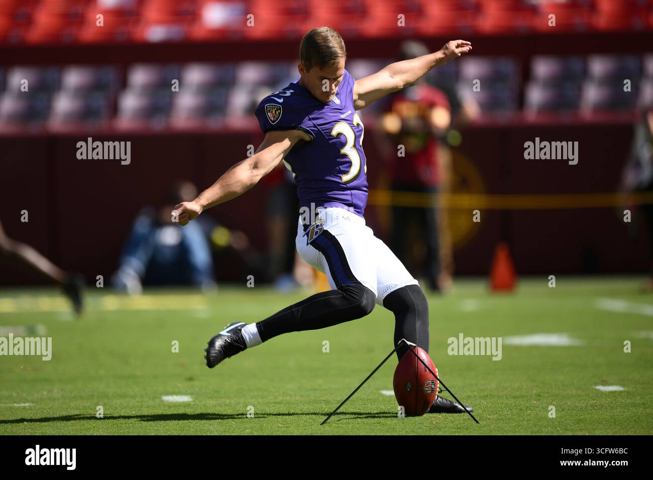 Baltimore Ravens place kicker Tyler Loop (33) warms up before an NFL ...