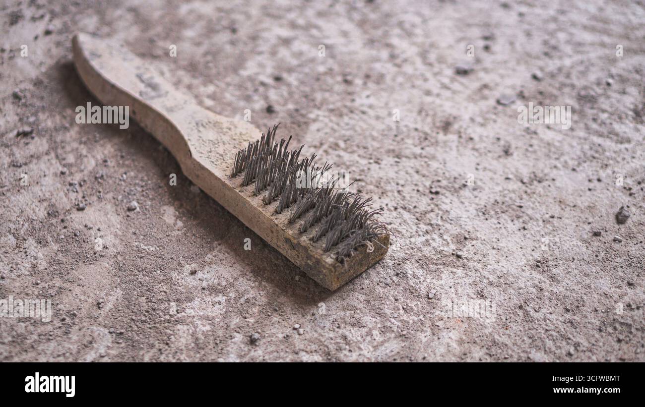Old worn-out steel wire brush with frayed bristles, showing textured ...