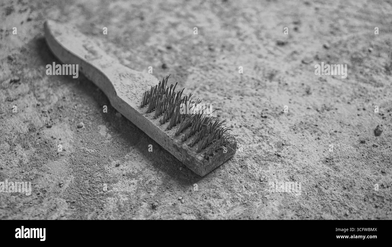 Old worn-out steel wire brush with frayed bristles, showing textured ...