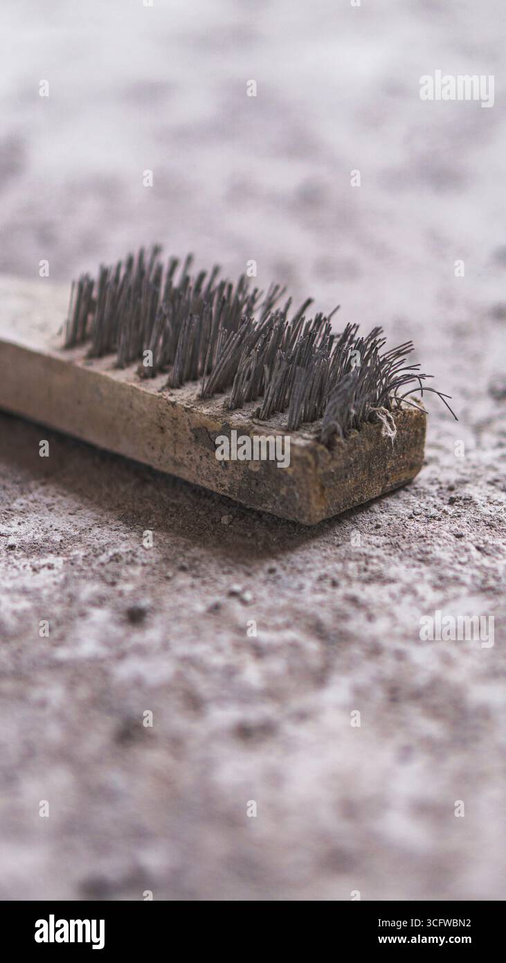 Old worn-out steel wire brush with frayed bristles, showing textured ...