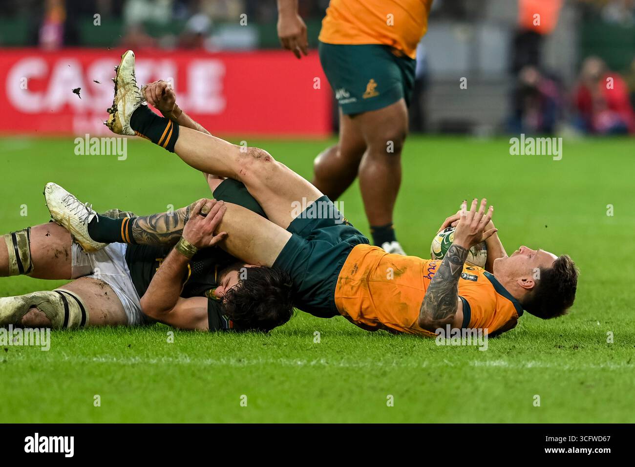 Corey Toole of Australia tackled by Ruan Nortje of South Africa during ...