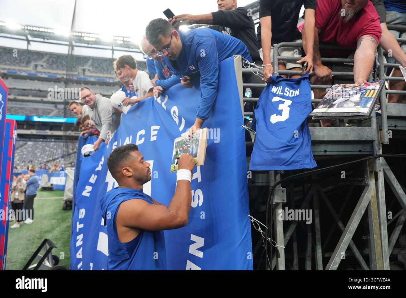 New York Giants quarterback Russell Wilson (3) signs autographs before ...