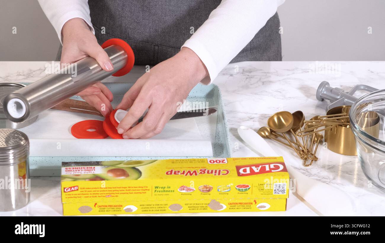 Cutting Plastic Wrap in Kitchen Setup Stock Photo - Alamy