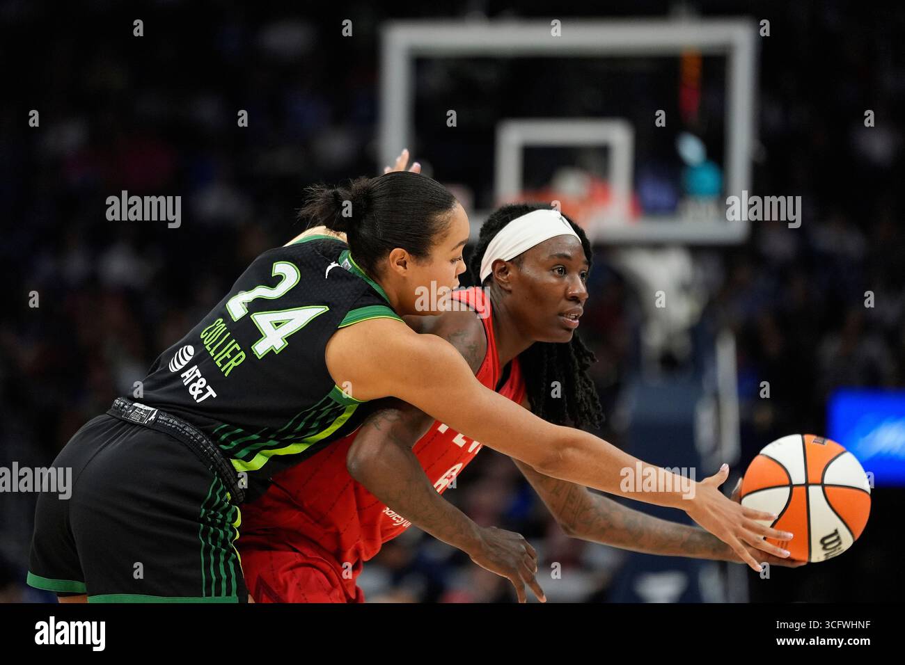 Indiana Fever forward Natasha Howard, right, handles the ball as ...