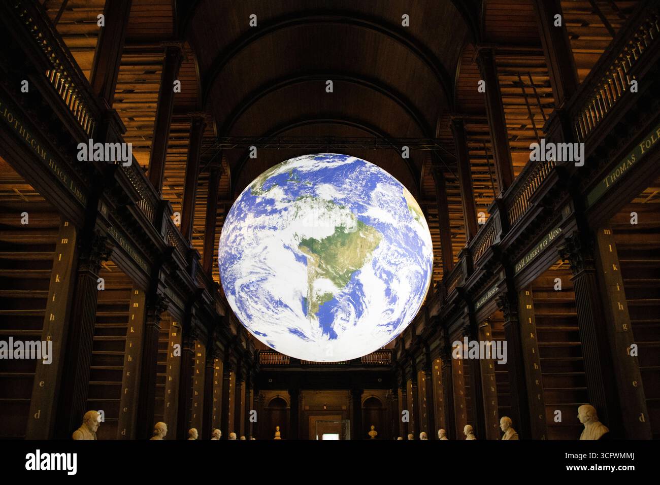 Earth in the Long Room, Old Library, Trinity College, Dublin Stock ...