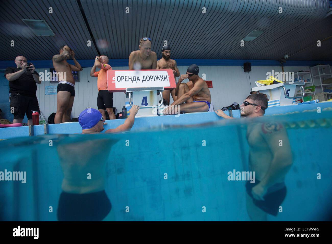 Coach Roman Korol, center, instructs Ukrainian war veteran Oleksandr ...