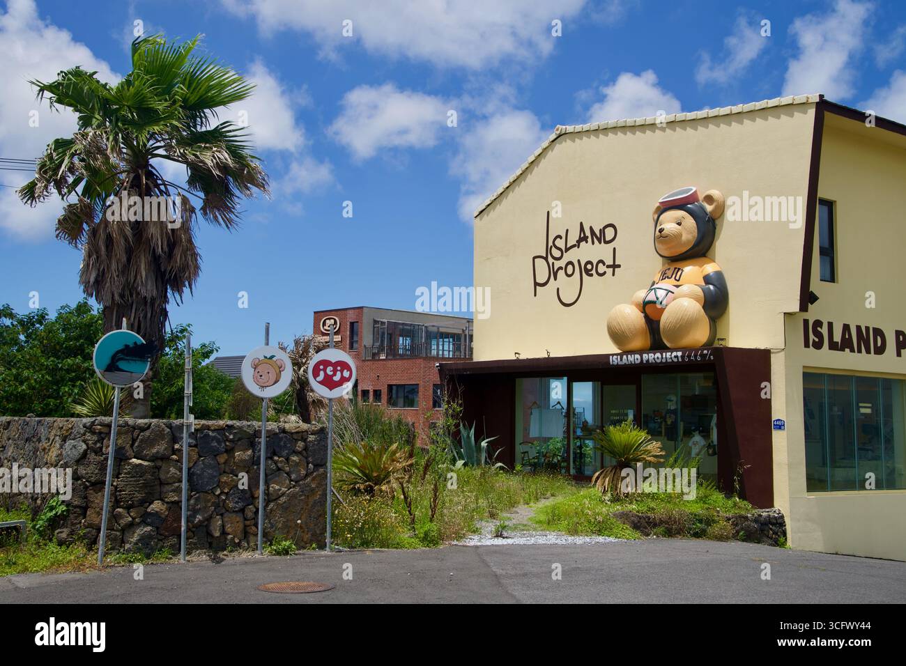 A travel logo with a palm tree on an island hi-res stock photography ...