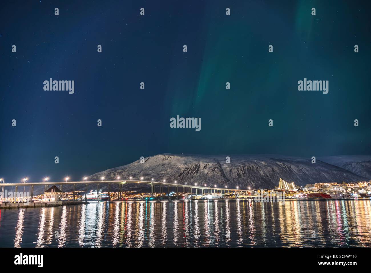 Tromso Norway, aurora borealis northern lights at city sentrum skyline ...