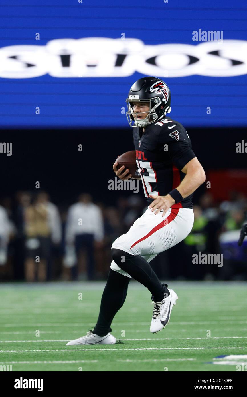 Atlanta Falcons quarterback Easton Stick (12) carries the ball during a ...