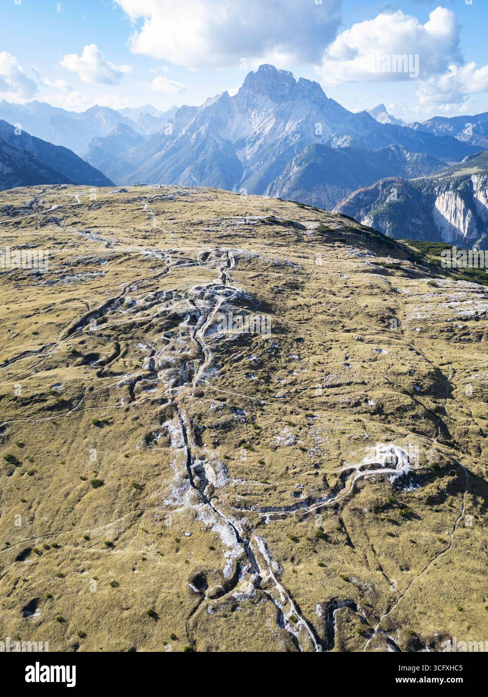 Aerial view of trenches cutting through rugged terrain towards the ...