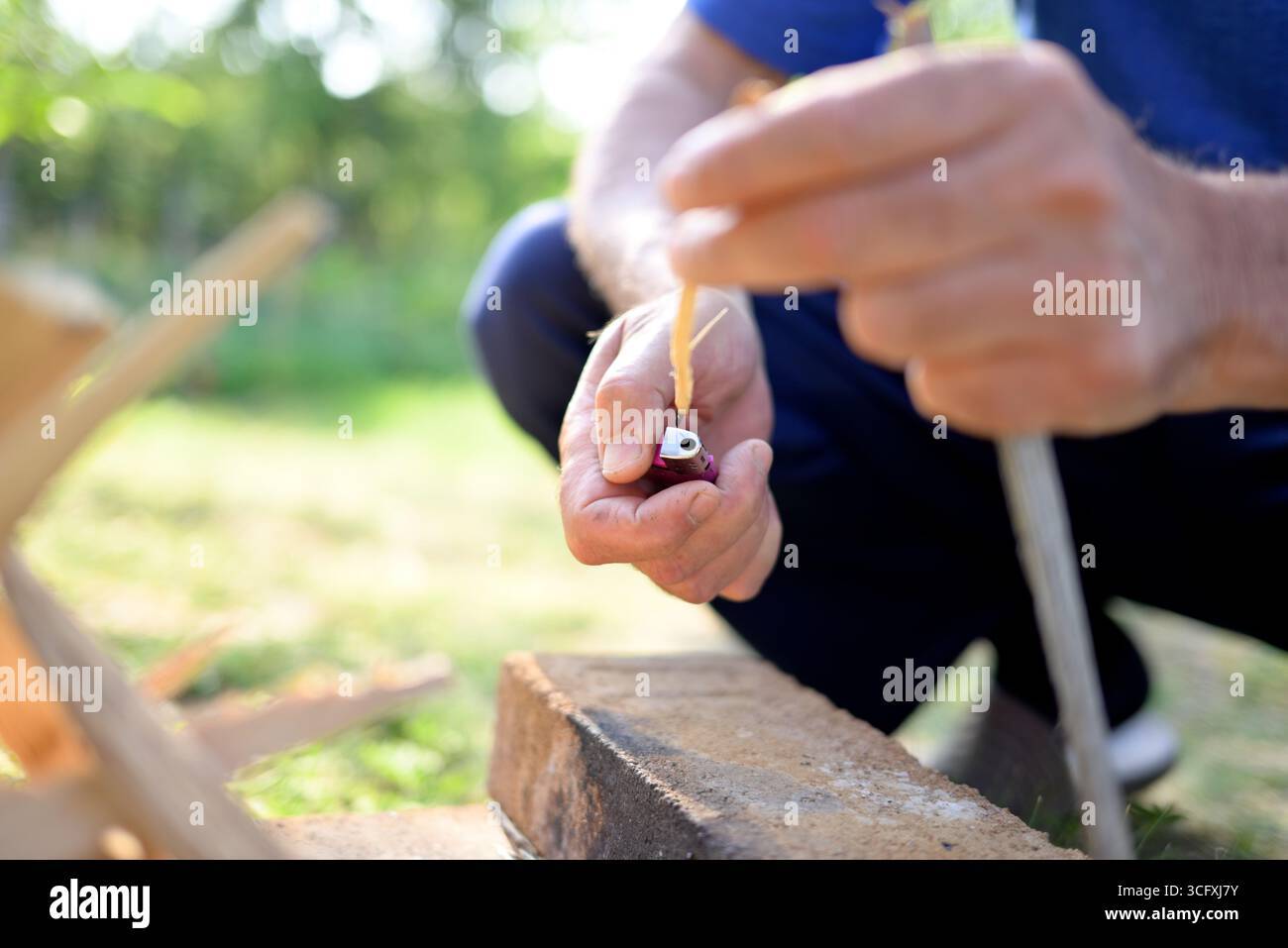 Person lighting matchstick outdoors hi-res stock photography and images ...