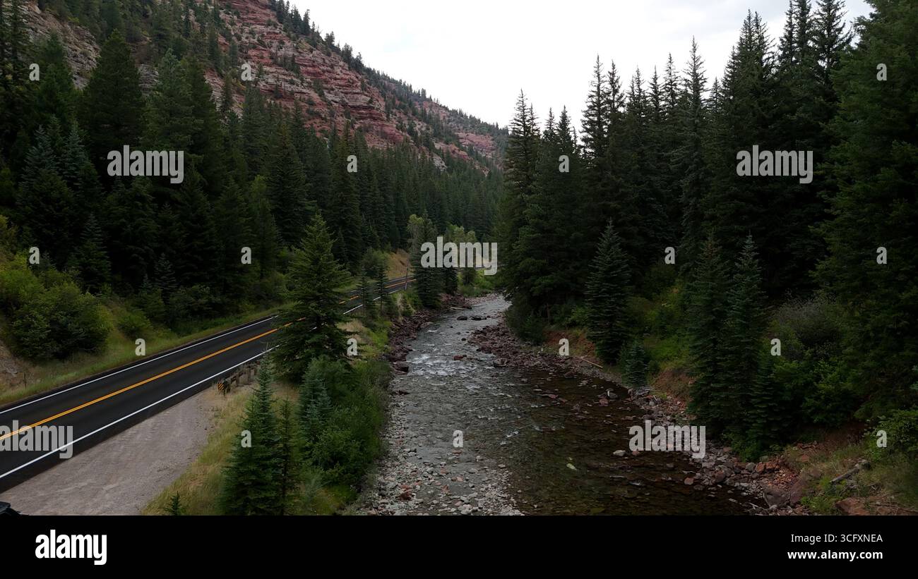 Aerial view of the Crystal River flowing alongside a road, with red ...