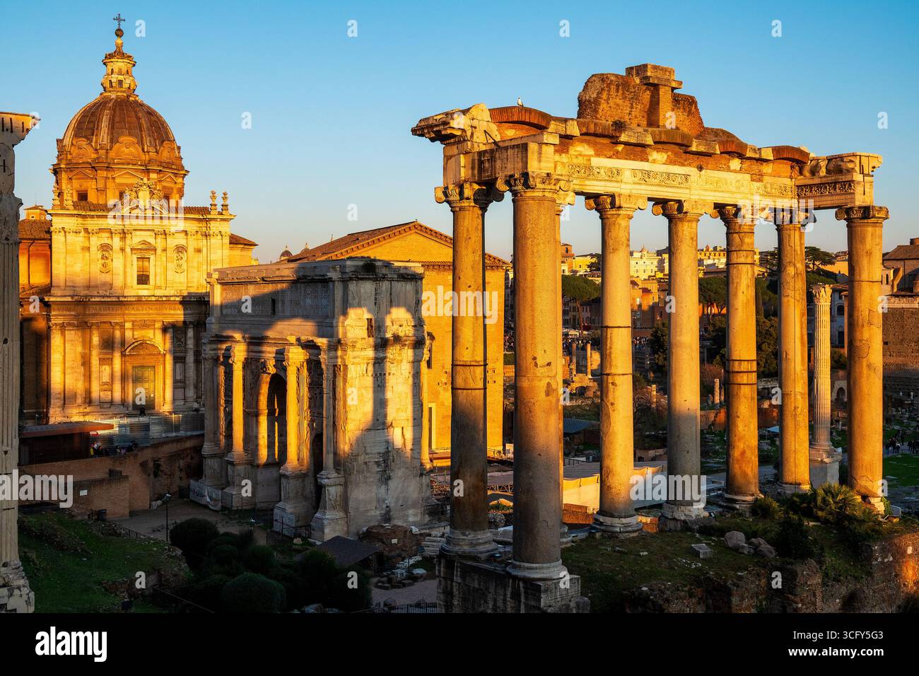 View of the Roman Forum at sunset with the Temple of Saturn, Arch of ...
