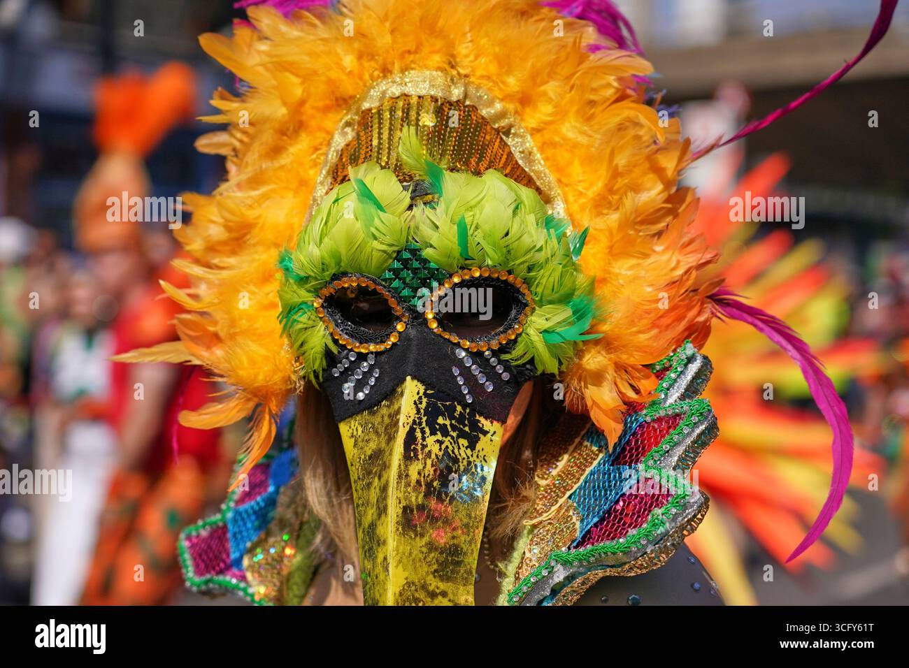 A reveller takes part in the parade during the Notting Hill Carnival in ...