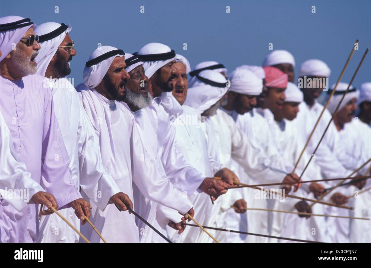 Abu Dhabi, men in traditional dance known as Al Ayyala (or Yowlah ...